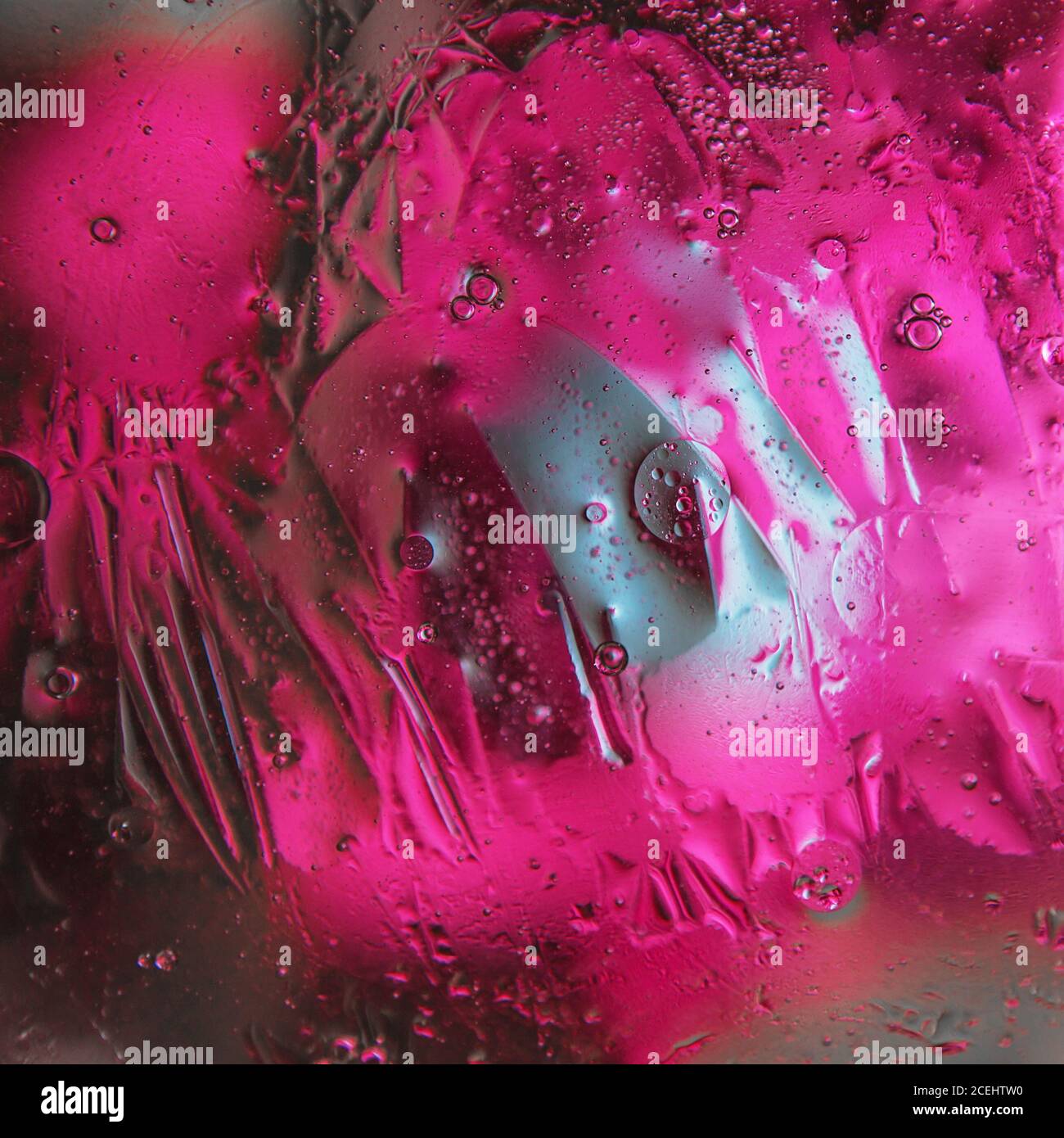 Abstract background of oil mixed with water in different color ...