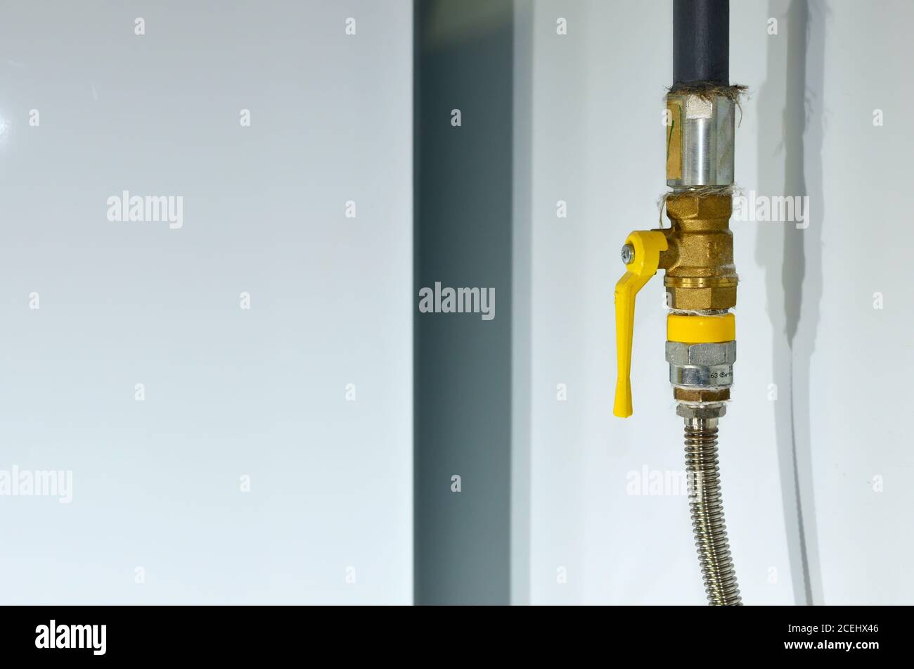 Gas Isolating Valve on pipe in house. The yellow handle lever ball ...