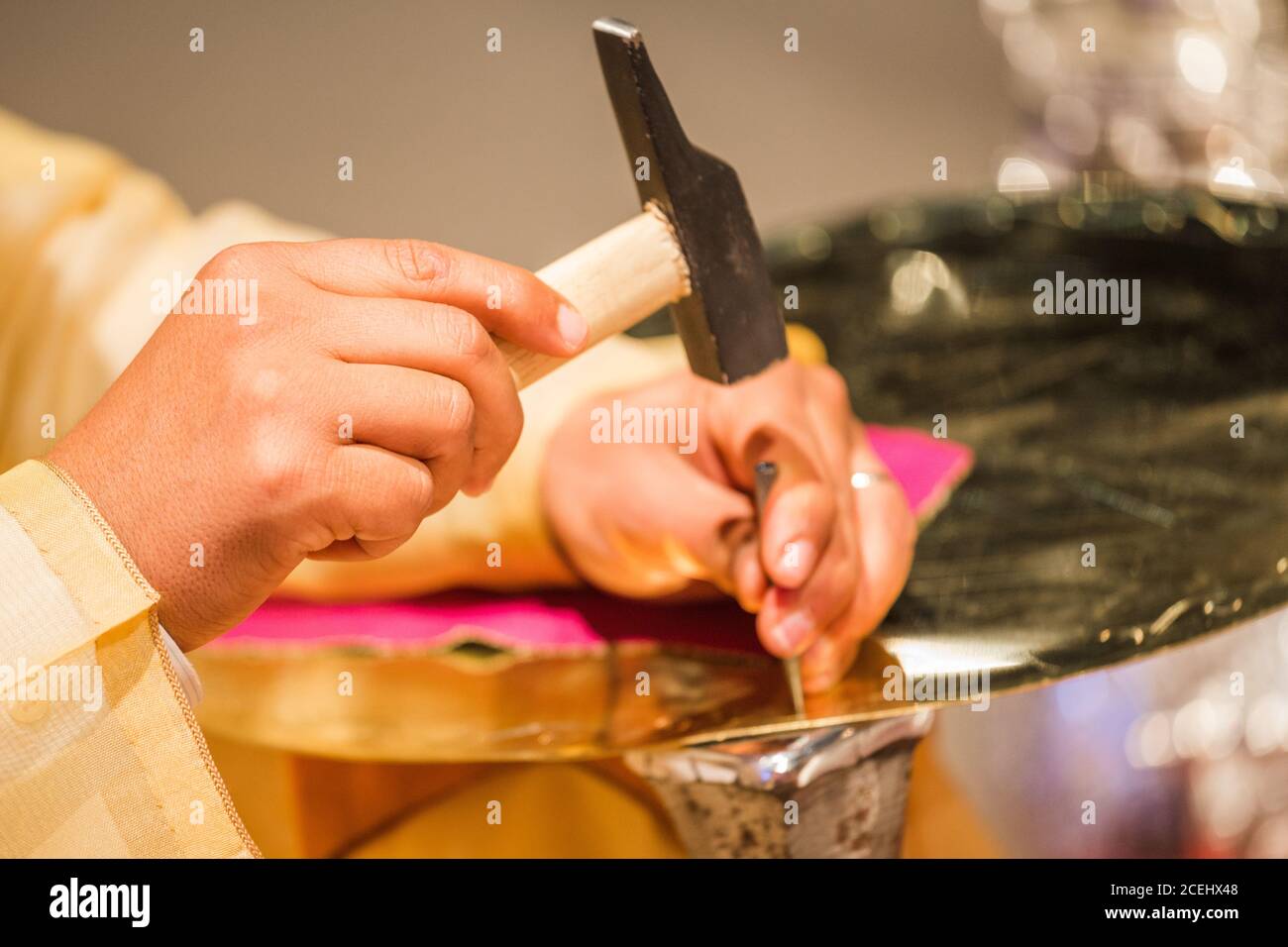 A moroccan artisan hammering a brass decorative plate . Morocco Stock ...
