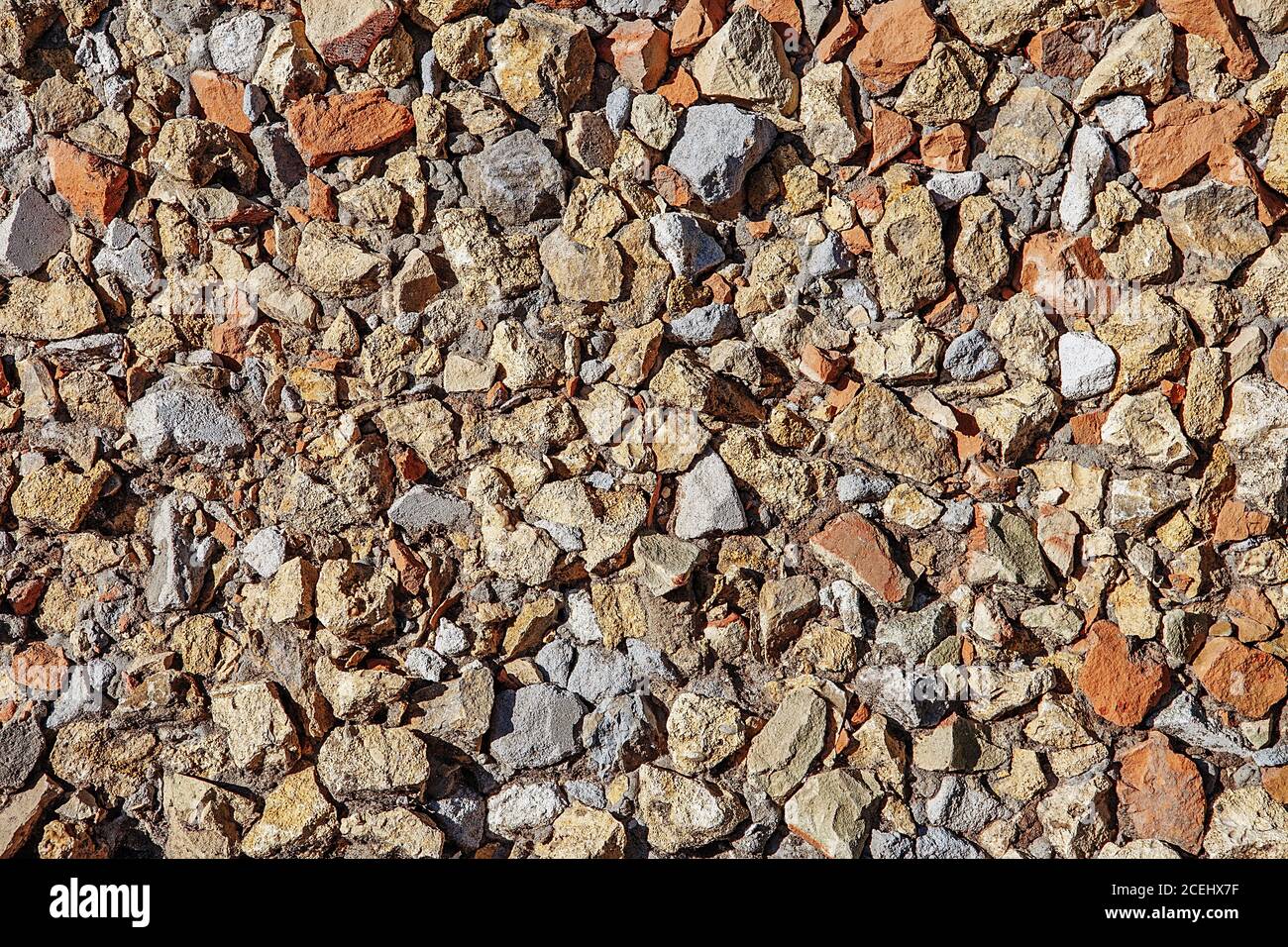 Background of chipped stones wall texture photo Stock Photo - Alamy