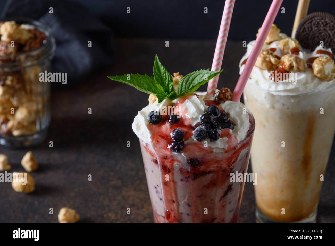 Delicious berry milkshake garnished with whipped cream, blueberries ...