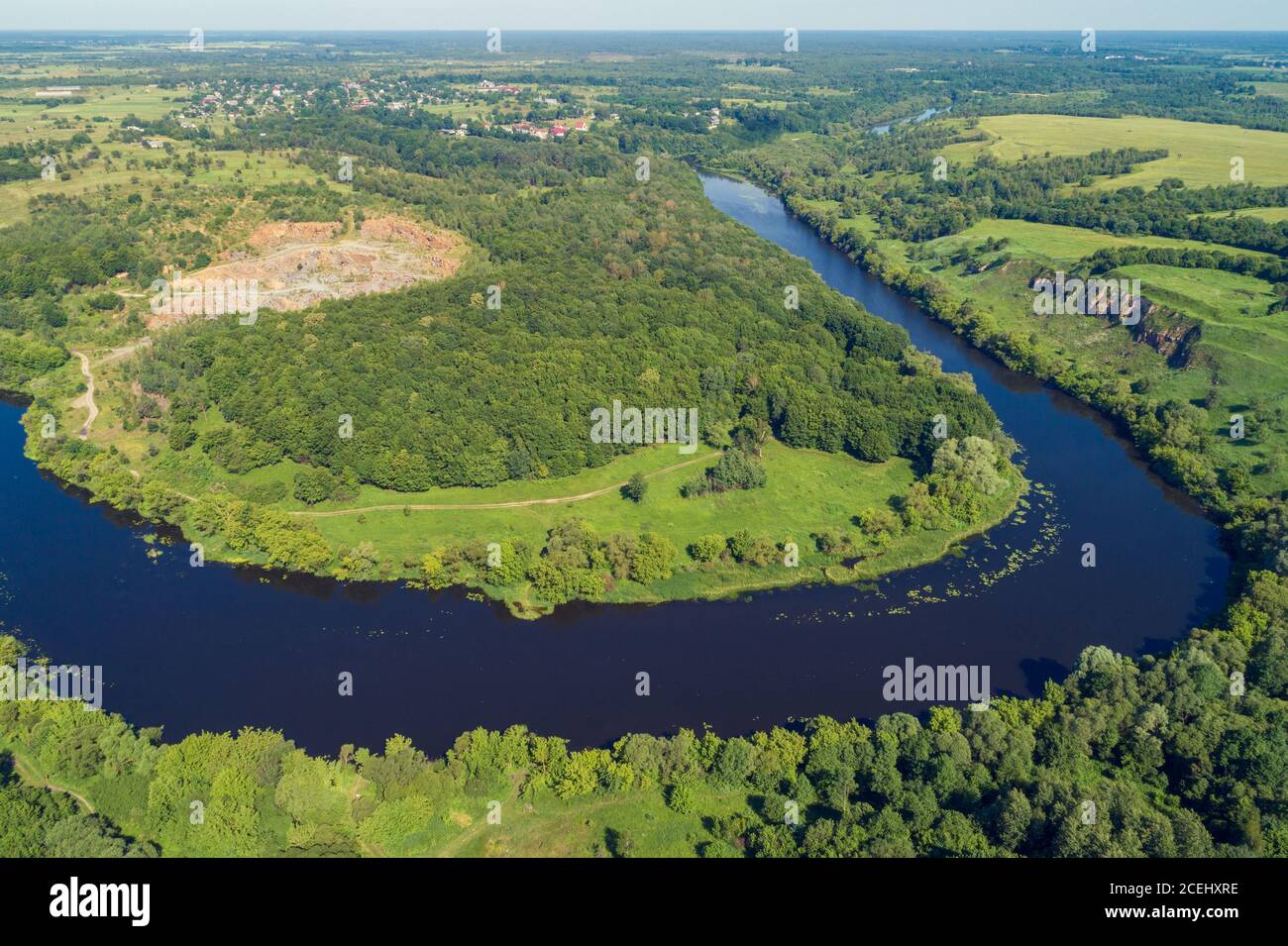 Green fields and trees with winding river hi-res stock photography and ...