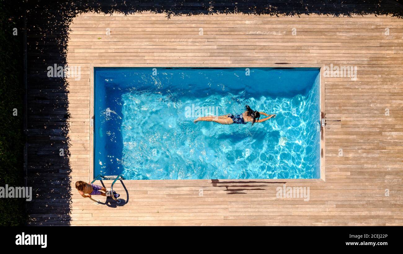 anonymous Woman swimming in pool Stock Photo - Alamy