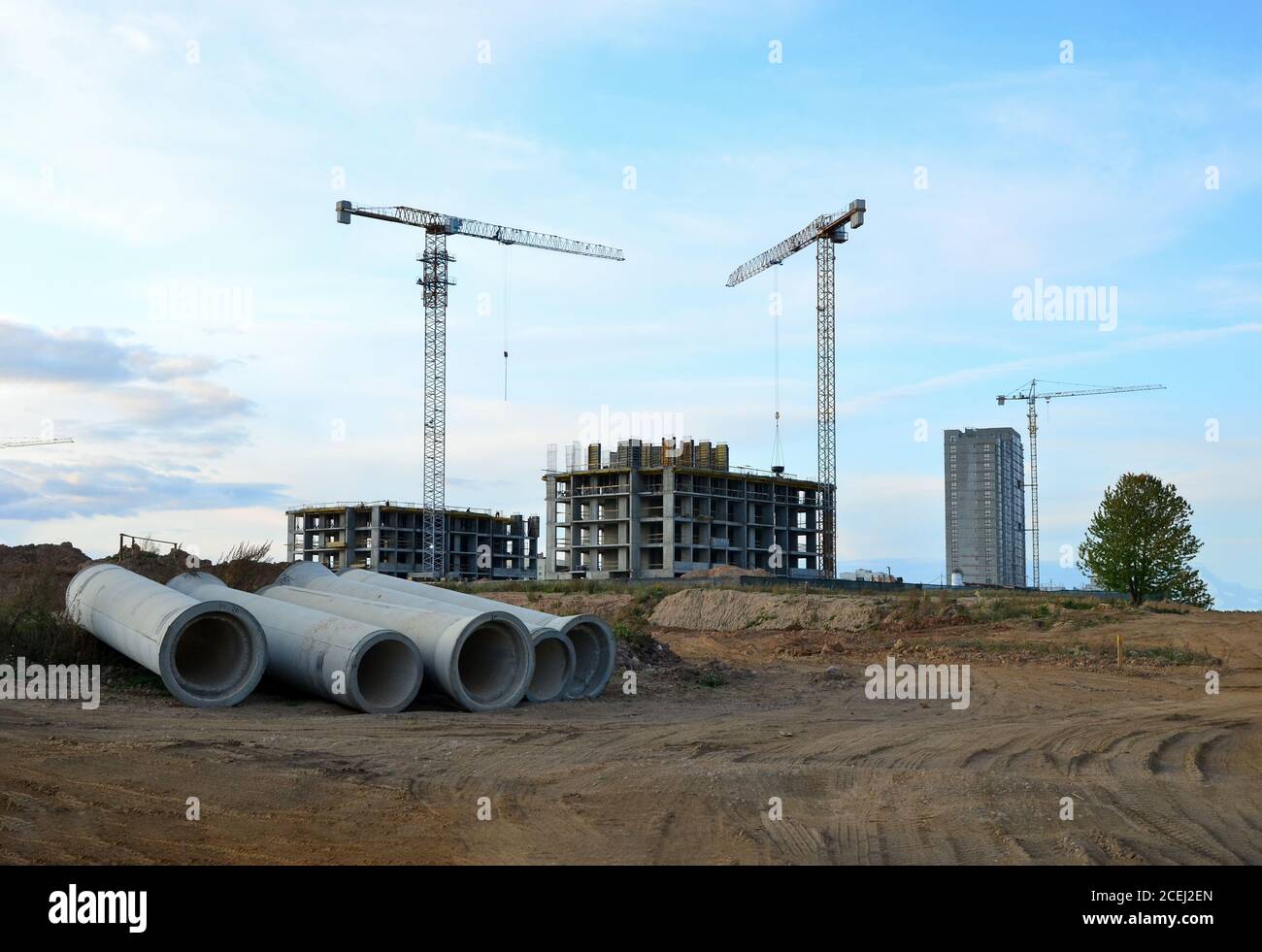 The drainage pipes at the large scale construction site against tower ...