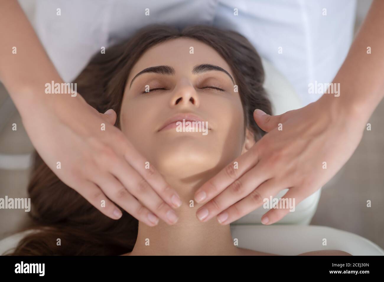 Hands on the neck hi-res stock photography and images - Alamy