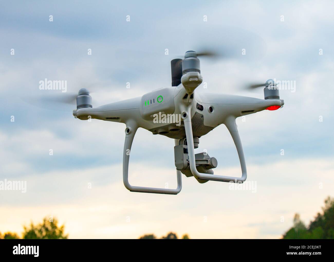 UAV White drone Quadr copter in flight with geodesic module and digital ...