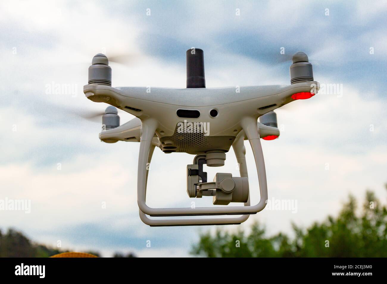 UAV White drone Quadr copter in flight with geodesic module and digital ...