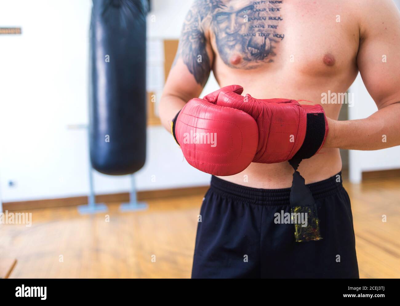 Young boxer wrapping his hand before training Stock Photo - Alamy