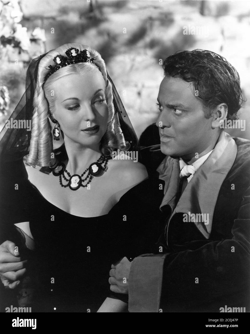 HILLARY BROOKE as Blanche Ingraham and ORSON WELLES as Edward Rochester ...