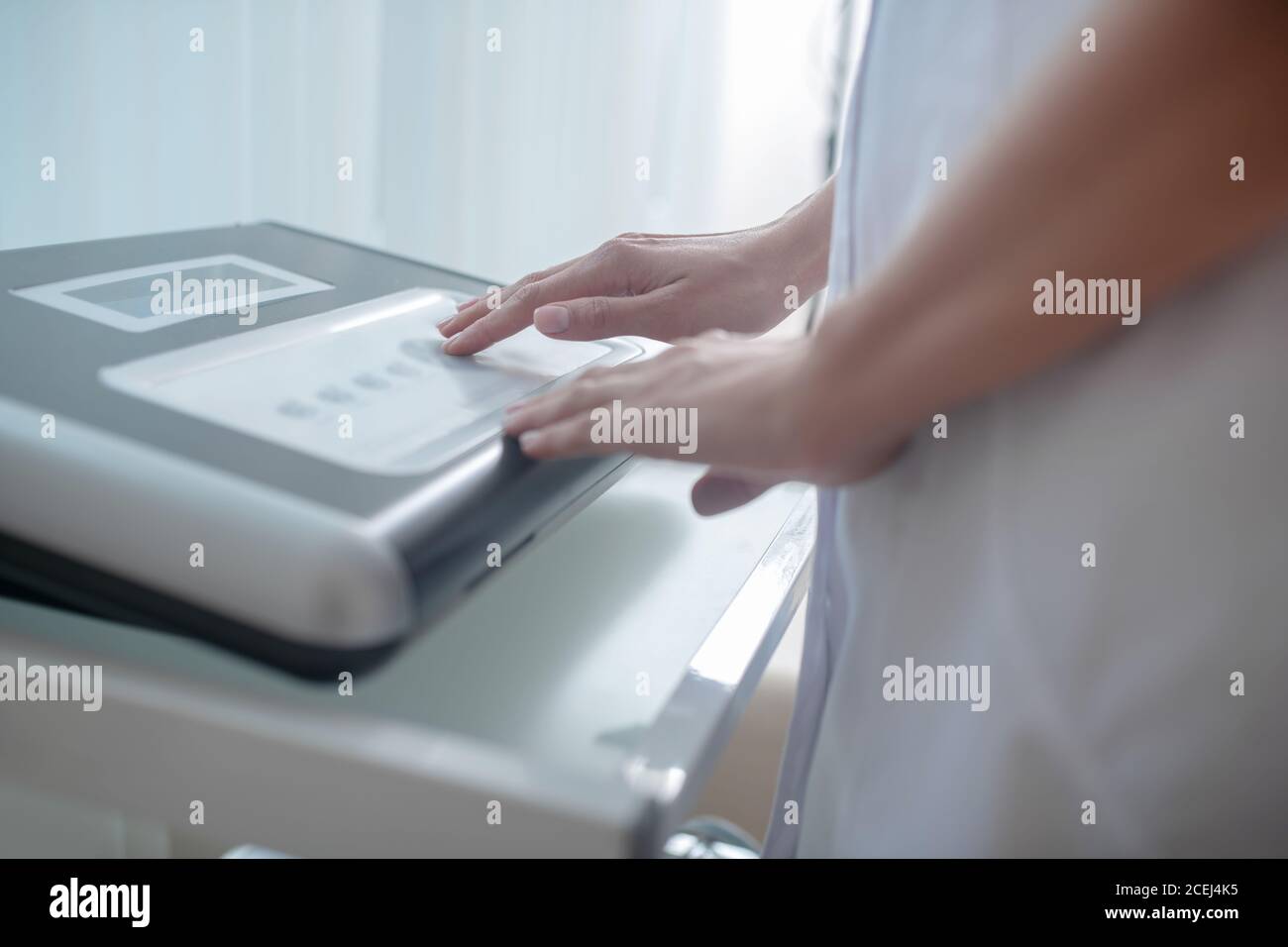 Close up picture of medical equipment and human hands touching it Stock ...