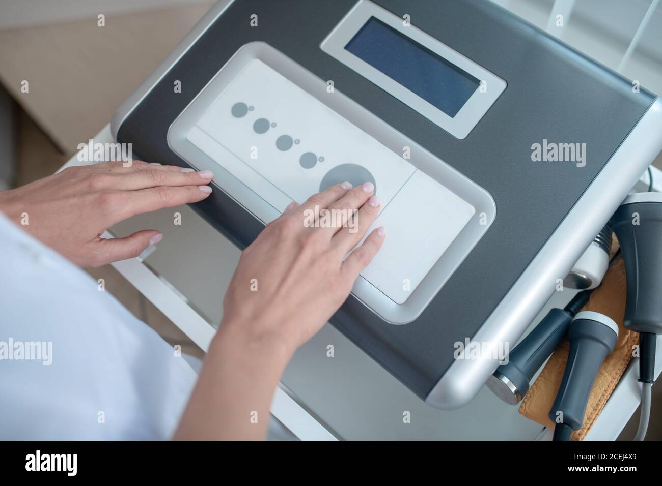 Close up picture of medical equipment and human hands pressing the ...