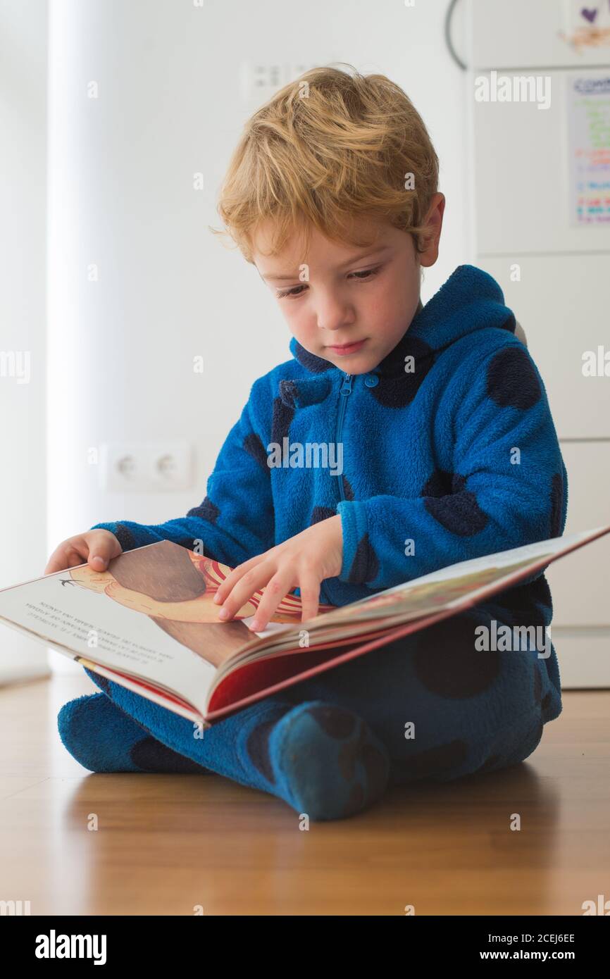 Book and child on floor hi-res stock photography and images - Alamy