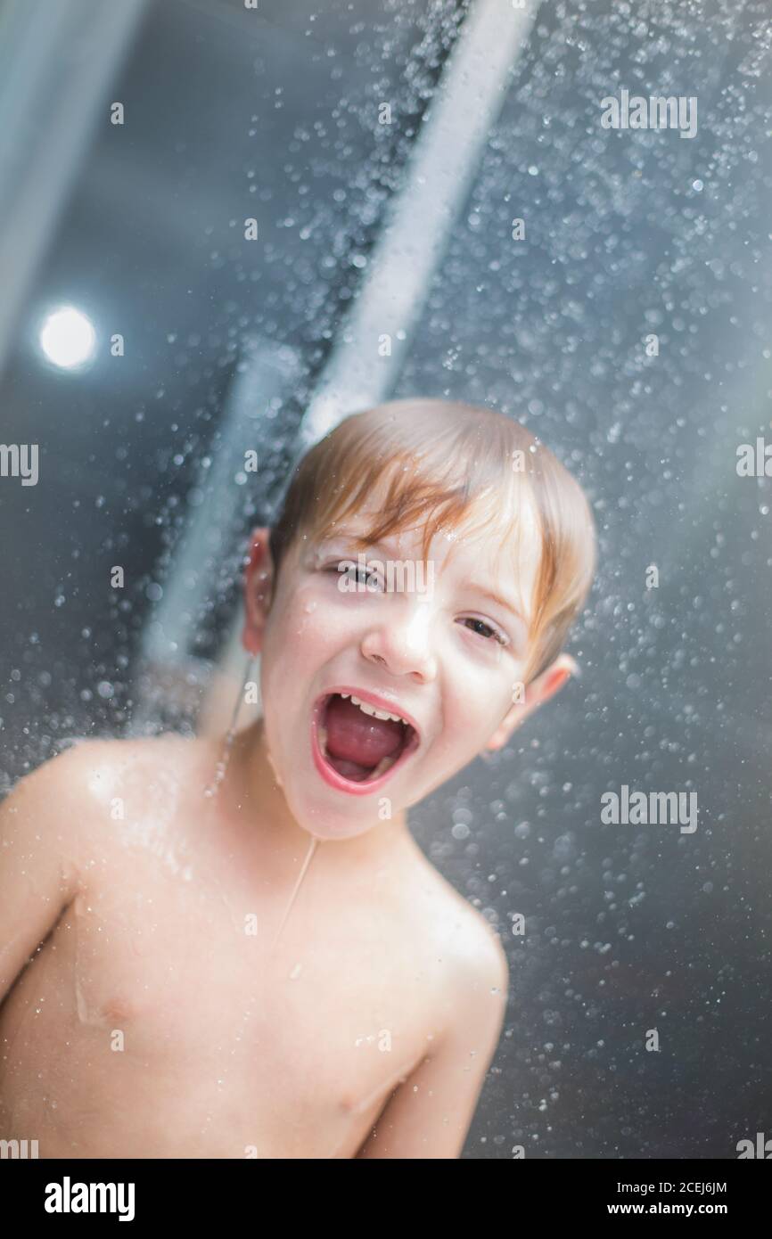 Boy in shower hi-res stock photography and images - Alamy