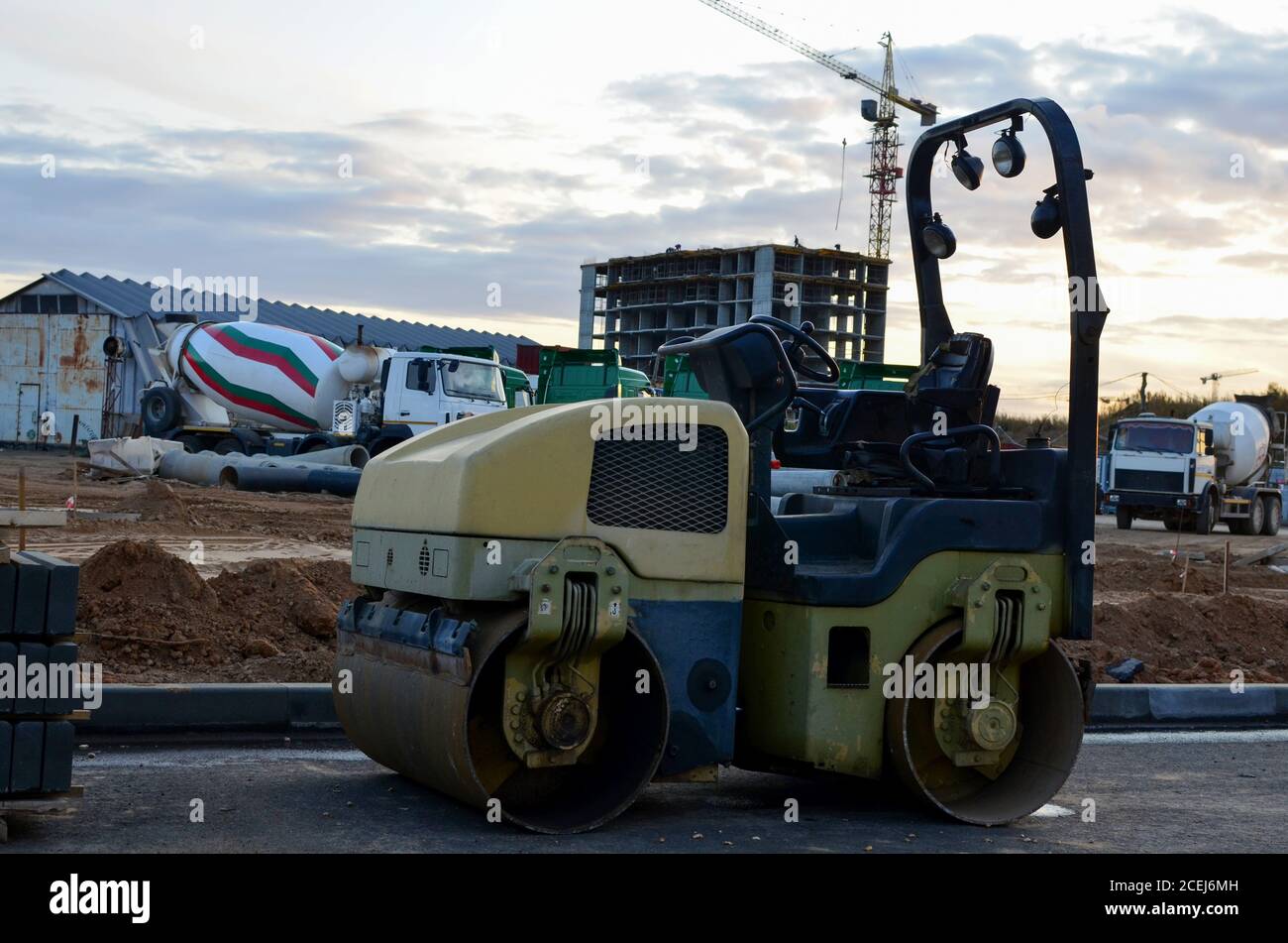 Road roller working at construction site during asphalt road repair ...