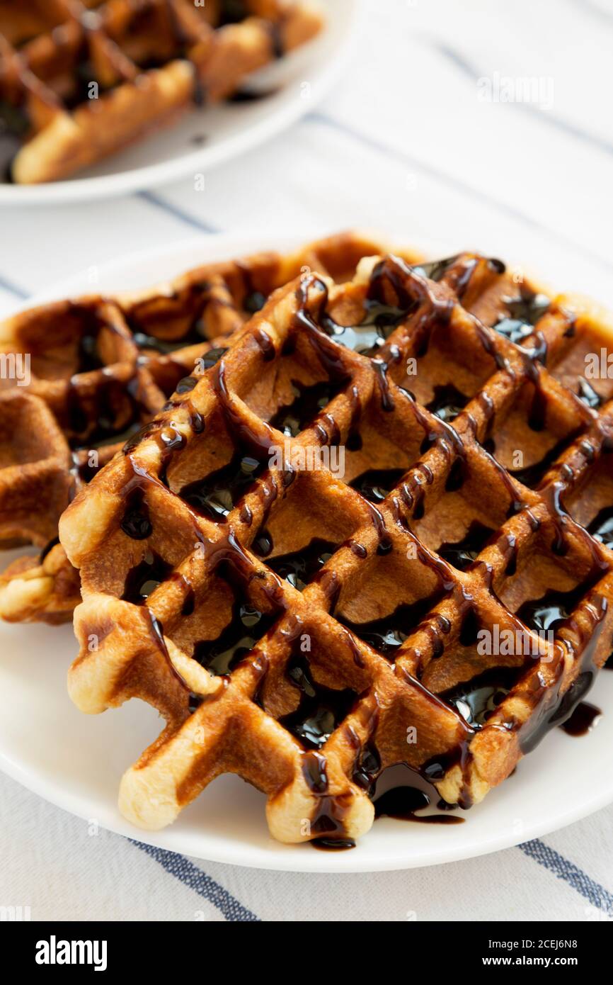 Yummy Homemade Belgian Sugar Waffles on a white plate on cloth, low ...