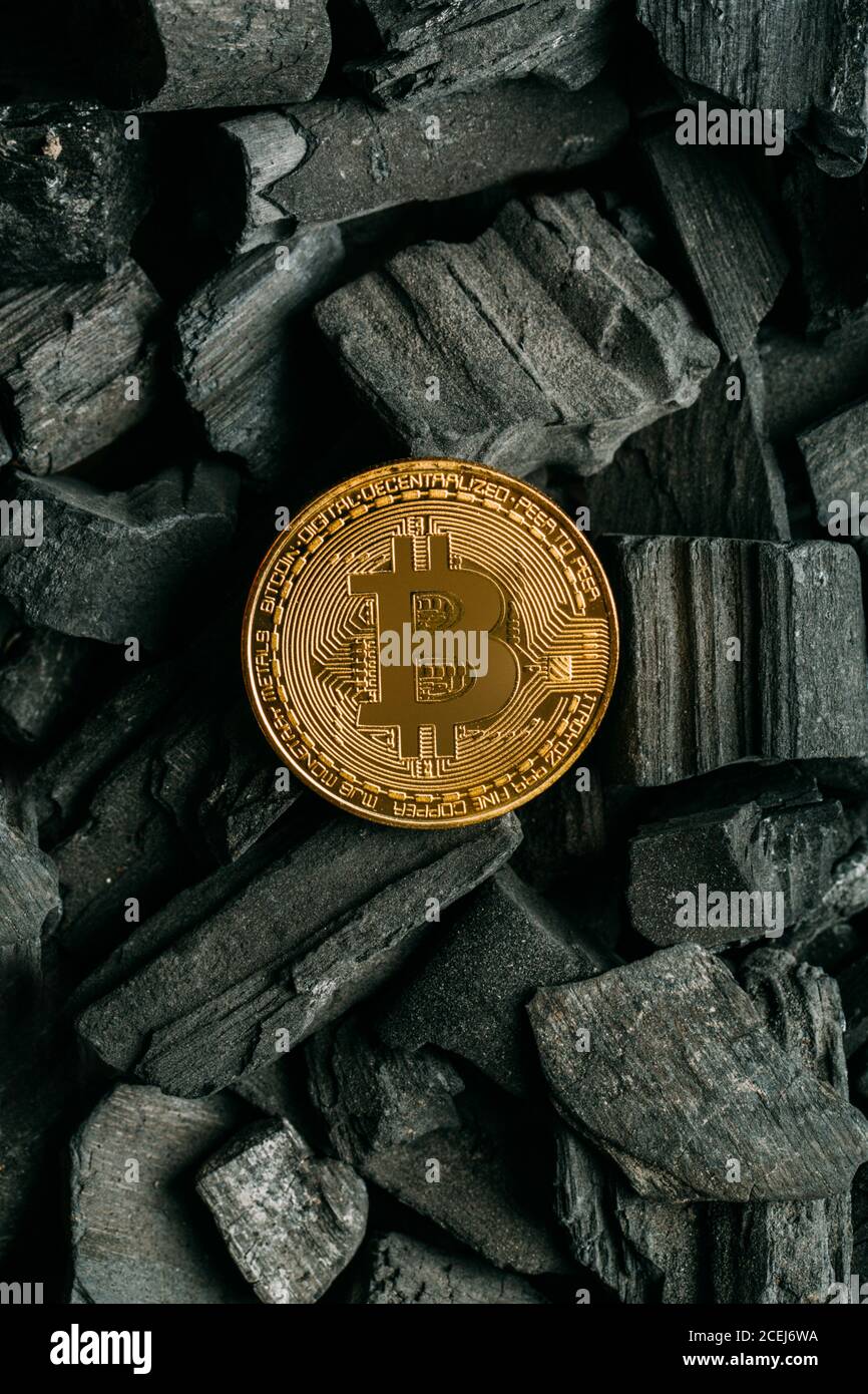 Bitcoins on coal background Stock Photo - Alamy