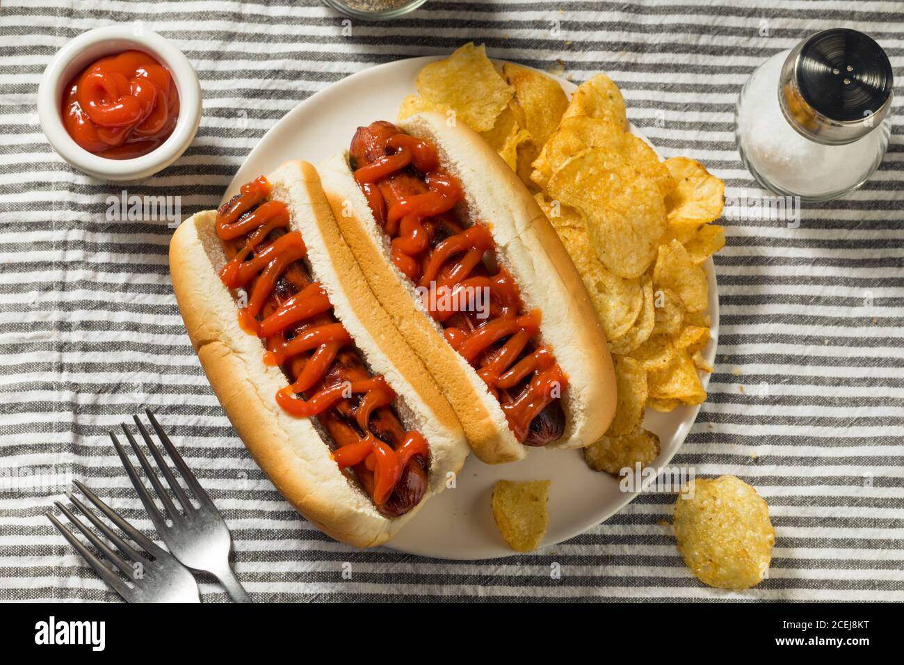 American Hot Dog with Ketchup with Potato Chips Stock Photo - Alamy