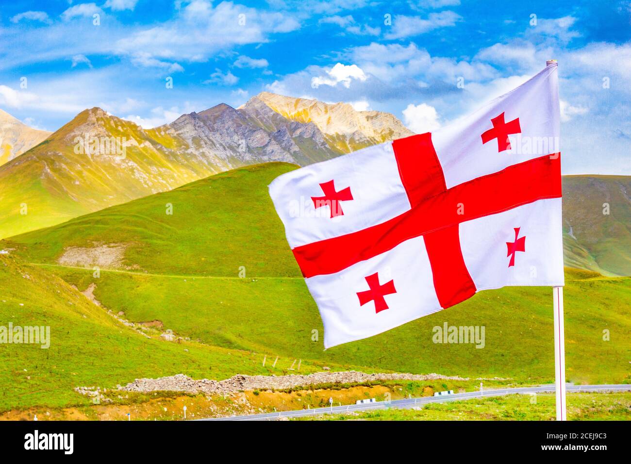 beautiful view to waving flag of Georgia on the Georgian military road ...