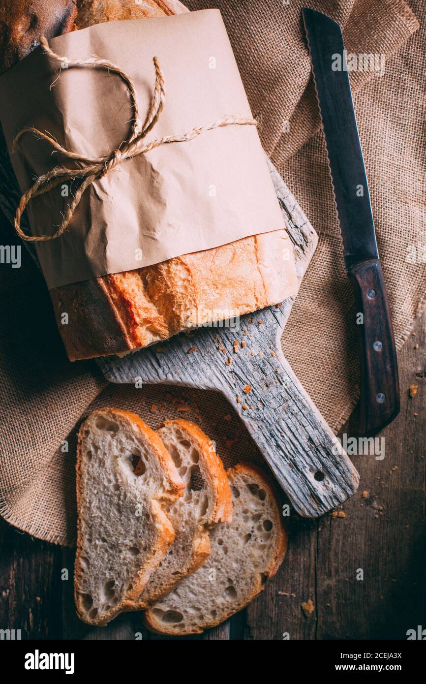 Rustic bread loaf on dark background Stock Photo - Alamy