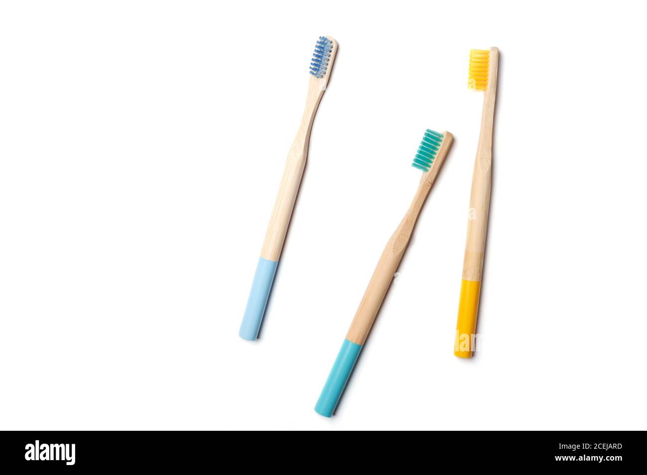 care for the environment - wooden bright toothbrushes on a white ...
