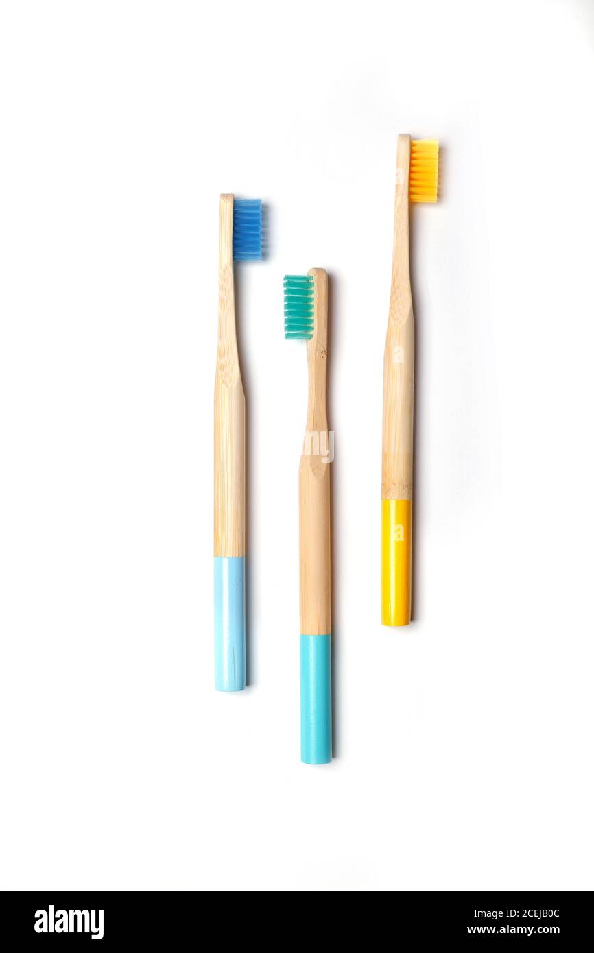 care for the environment - wooden bright toothbrushes on a white ...