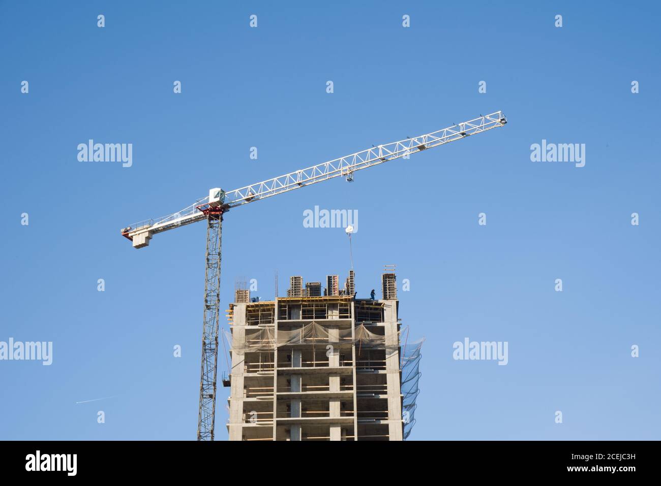 Tower crane lifts the block for building under construction at ...