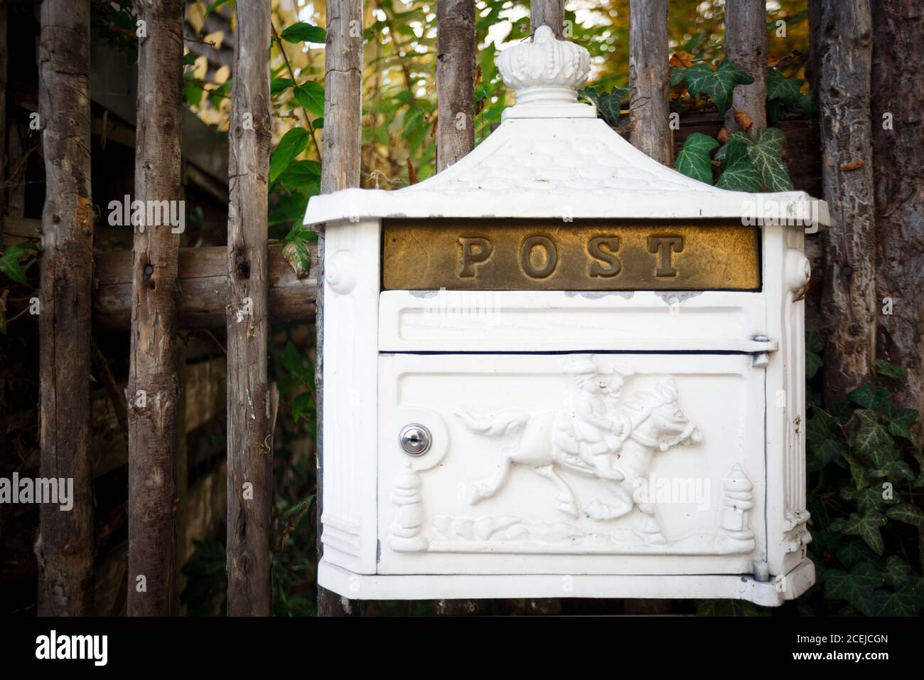 beautiful white letter-box on the fence Stock Photo - Alamy