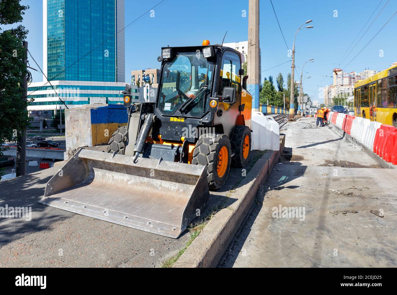 A light construction bulldozer during the repair of an asphalt road on ...