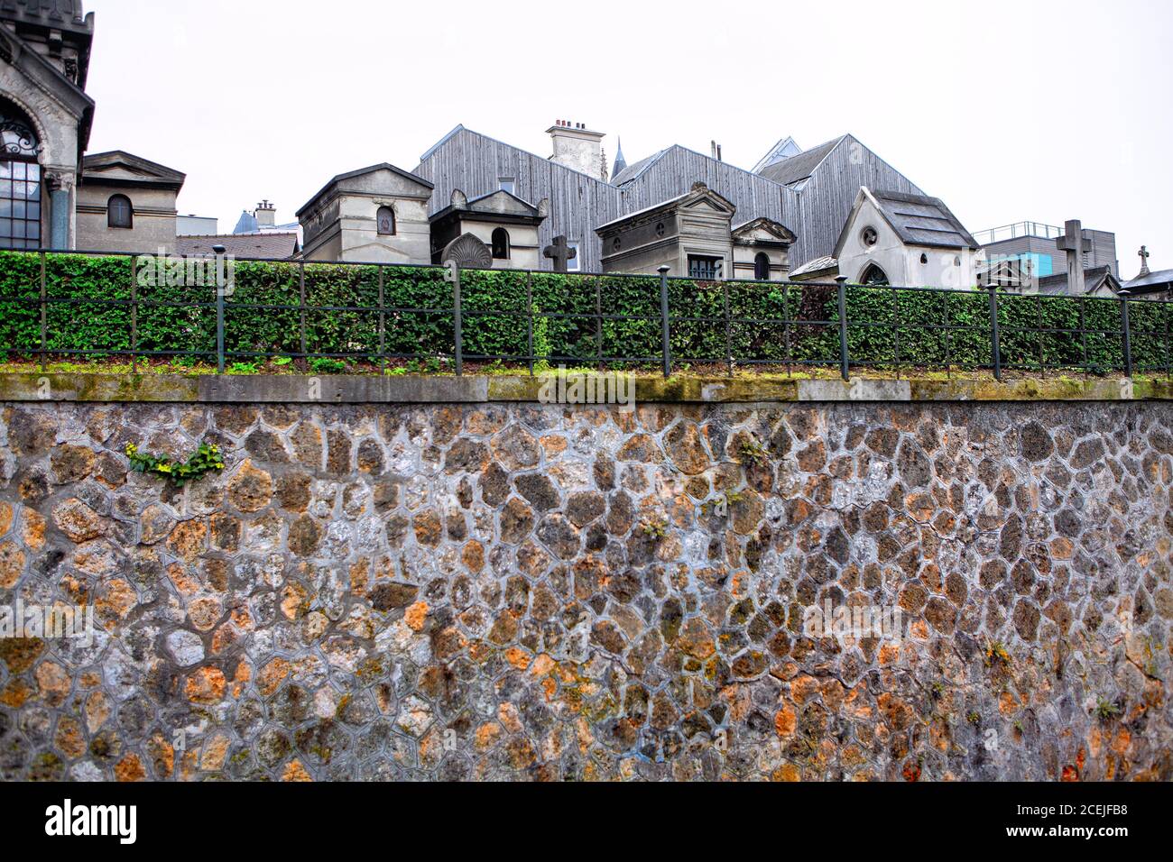 Stone wall and crypts above . Graveyard with tombs Stock Photo - Alamy