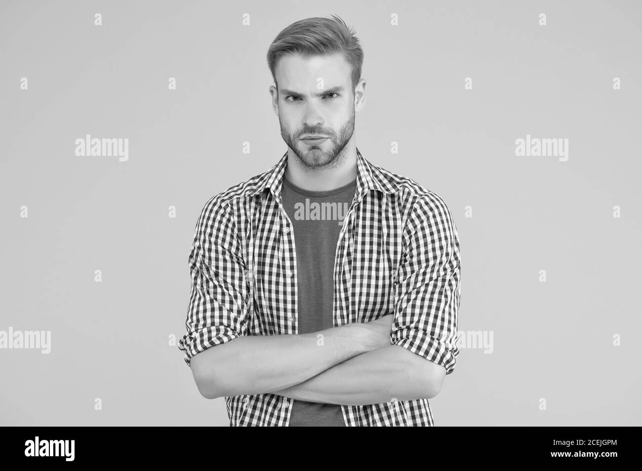 Charismatic fashion model. Handsome unshaven man. Man wear checkered ...