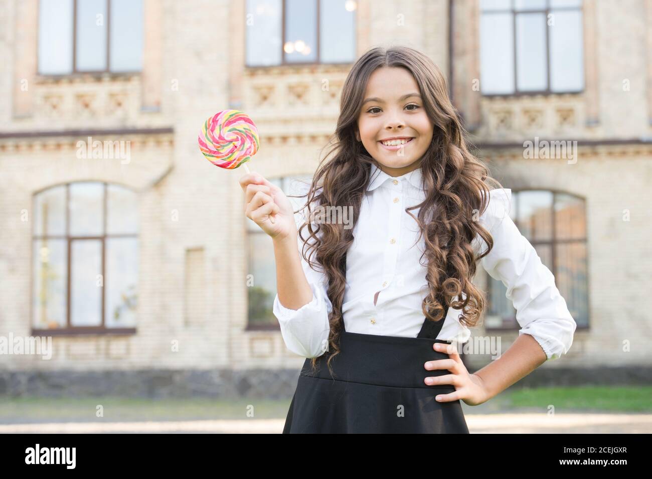 Sweet joy. Happy kid with sweet candy. Happy childhood. Kid child ...