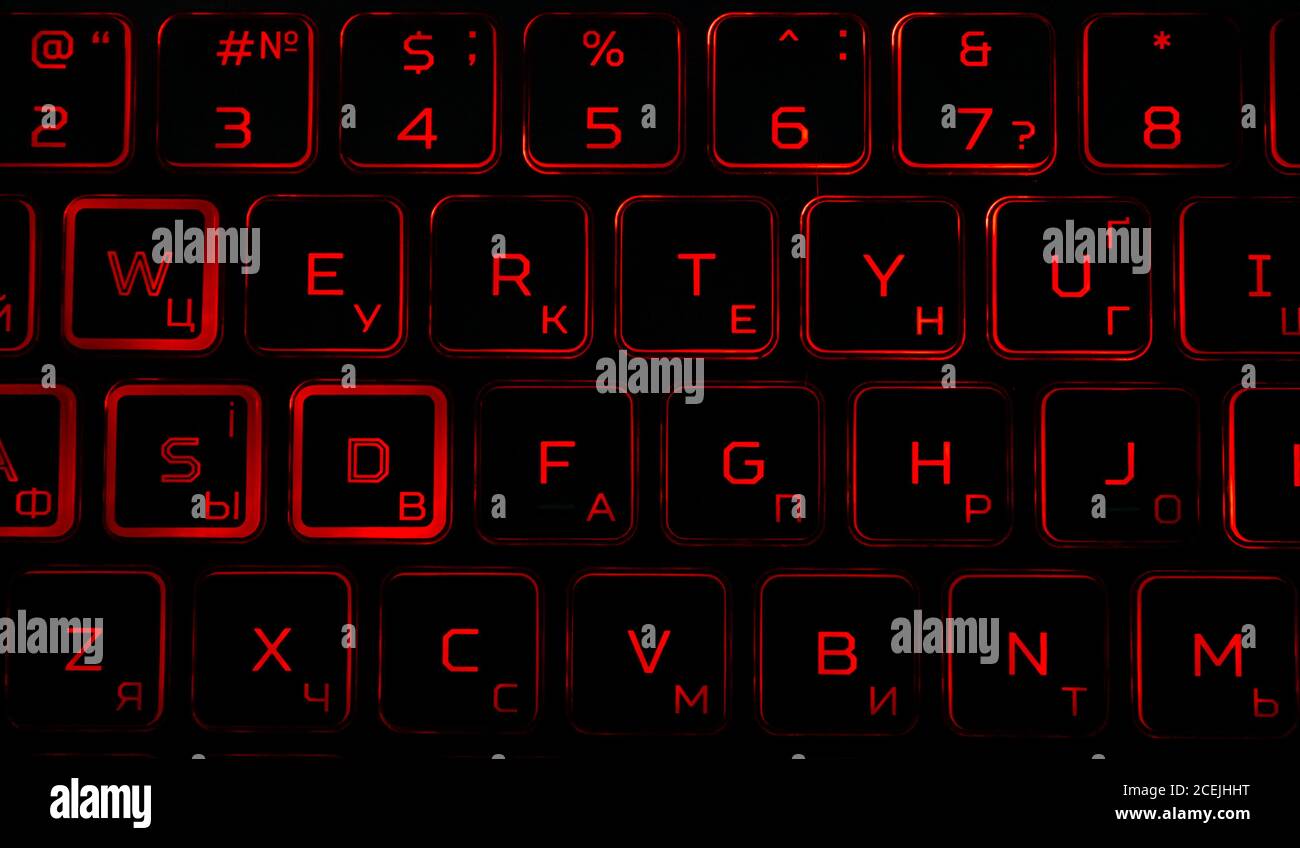 Black computer keyboard with red backlight in the dark Stock Photo - Alamy