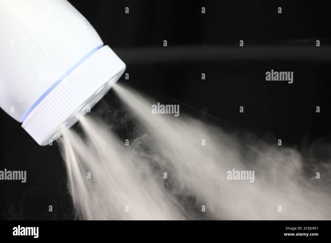 Talcum powder being applied Stock Photo - Alamy