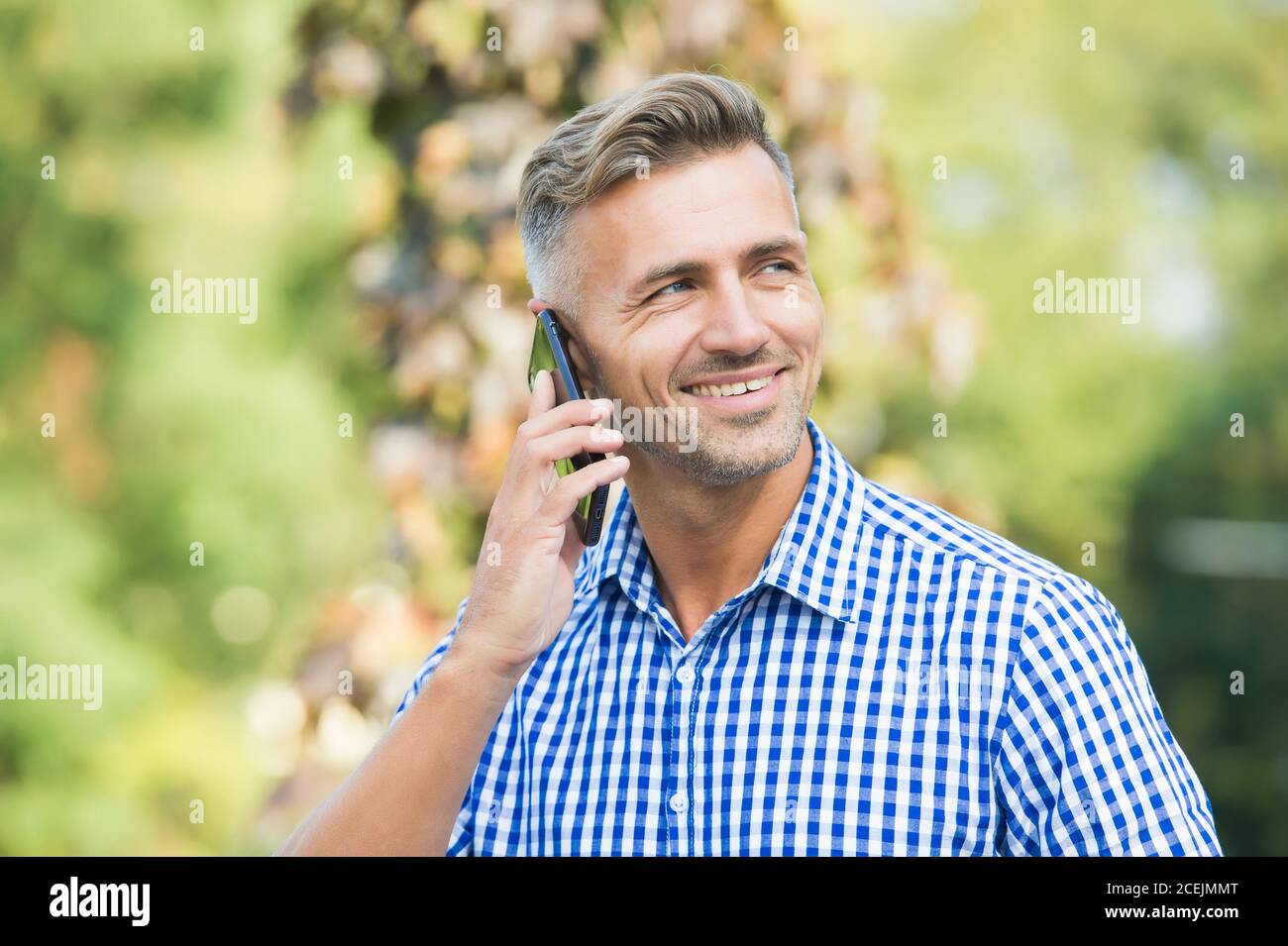 happy man speaking on mobile phone, modern life Stock Photo - Alamy