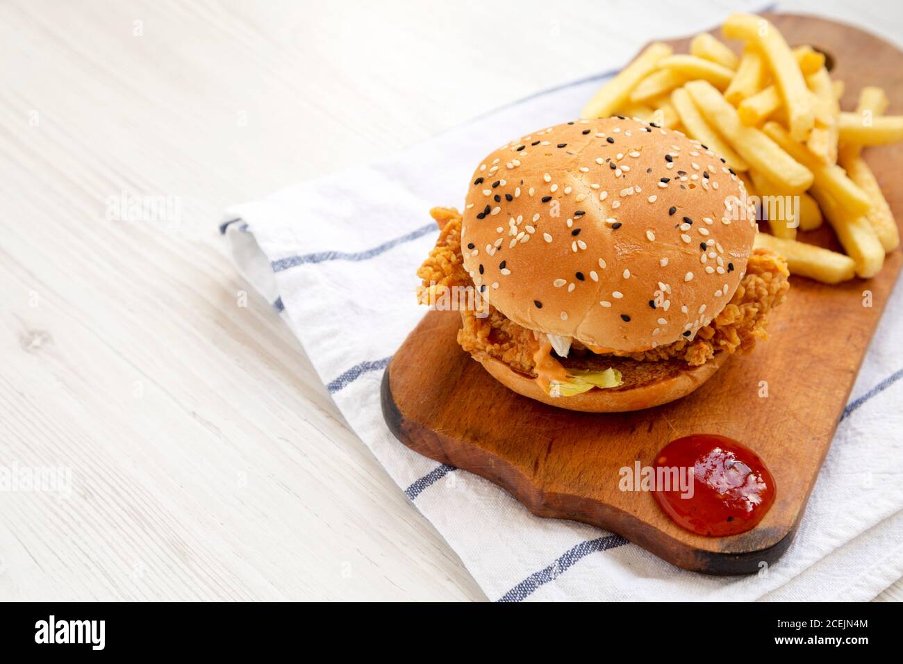 Homemade Chicken Strips Burger with French Fries and sour-sweet sauce ...