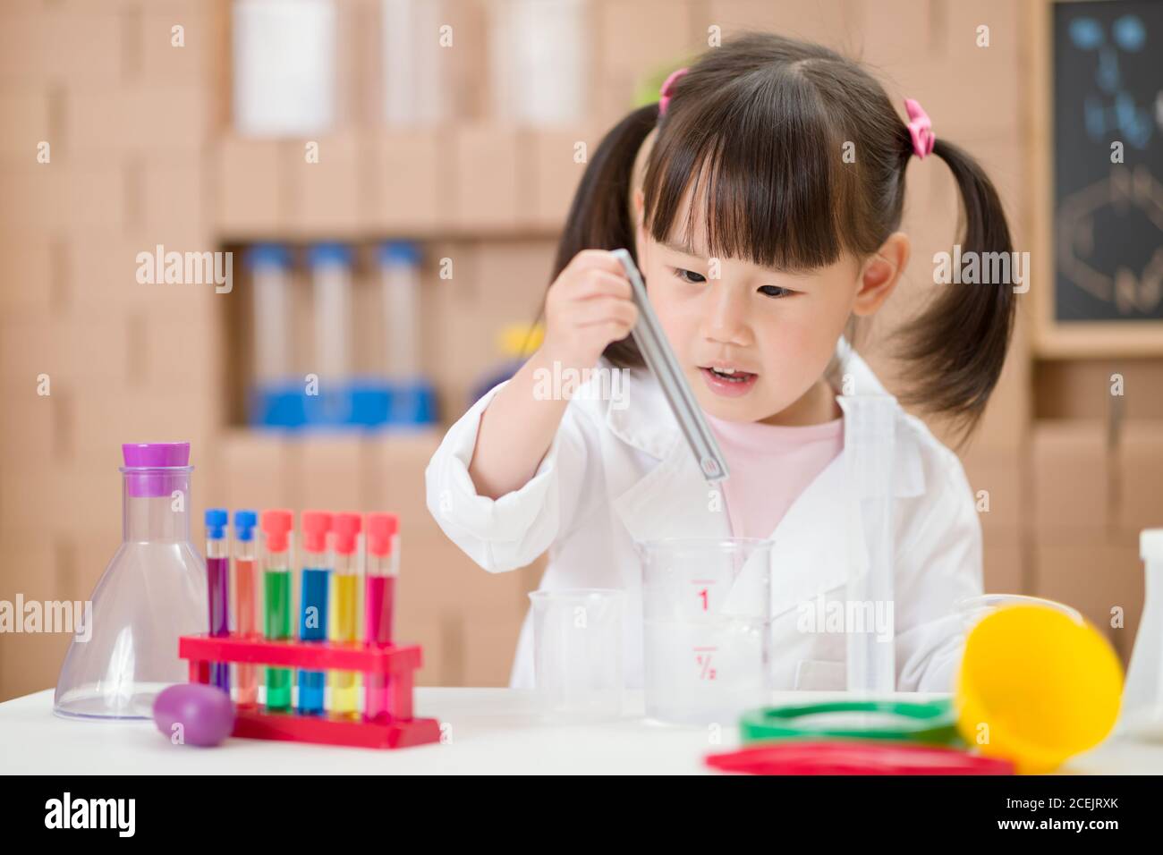 young girl play science experiments for homeschooling Stock Photo - Alamy