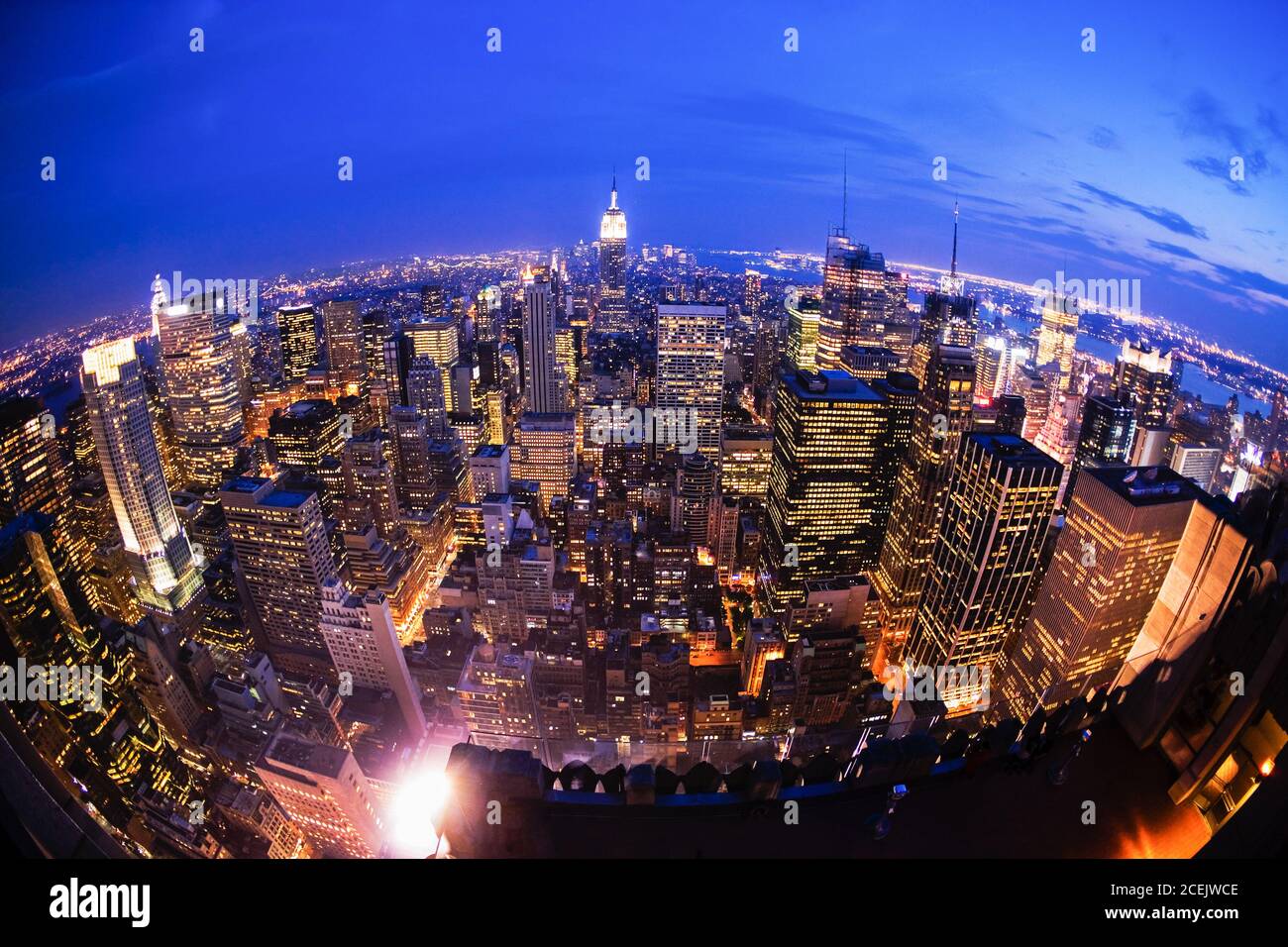 Wide angle shot of glowing modern metropolitan city from height in ...