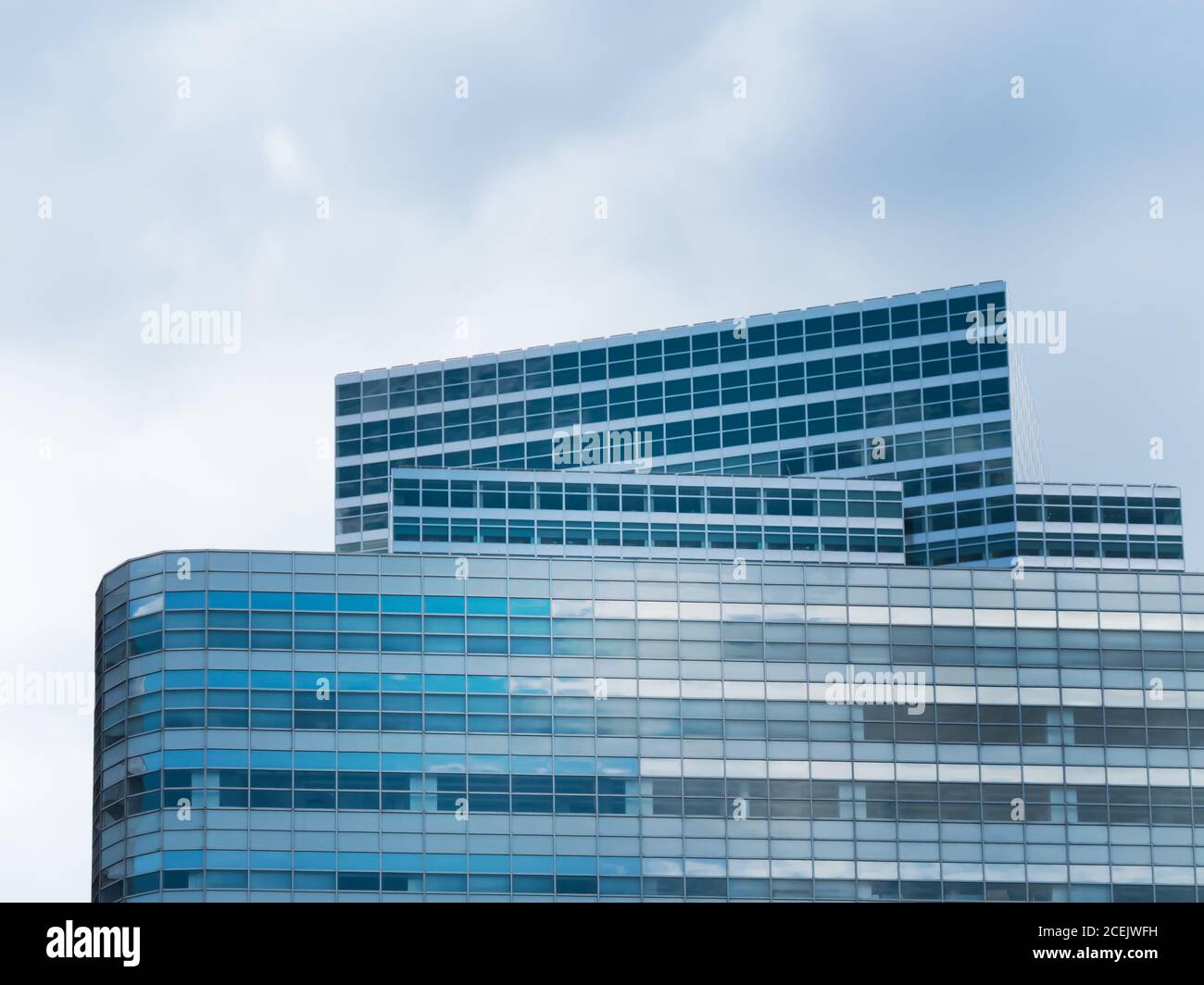 Exterior of blue bright shiny skyscraper facade with glass windows ...