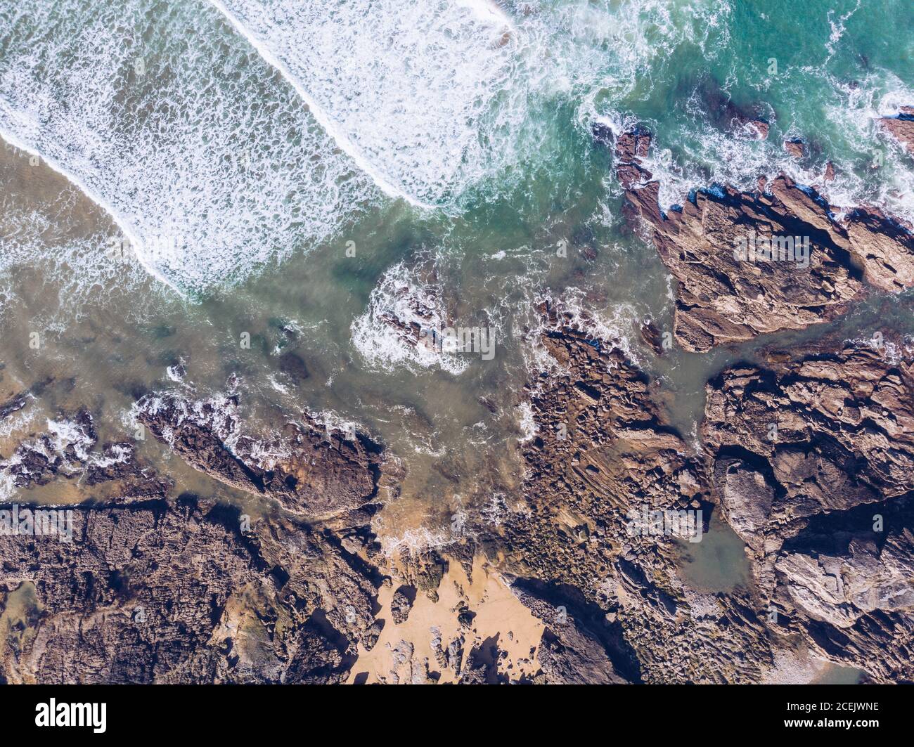 From above shot sea water waving near rocky coast asturias hi-res stock ...