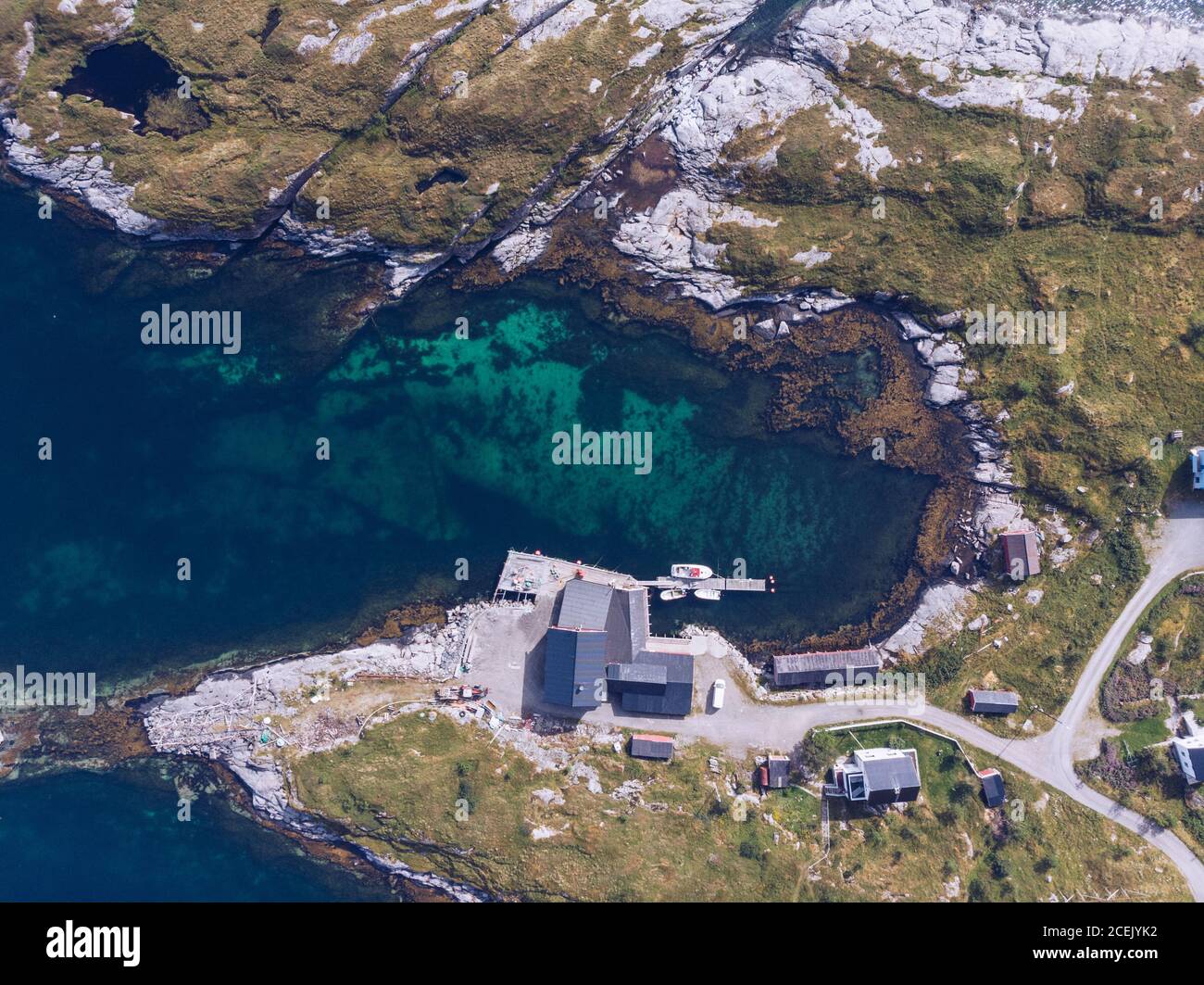 Colorful shoreline of island with port Stock Photo - Alamy
