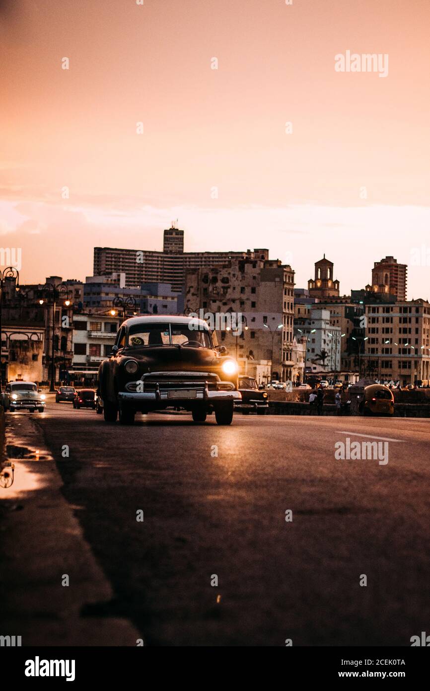 Classic car driving sunset hi-res stock photography and images - Alamy