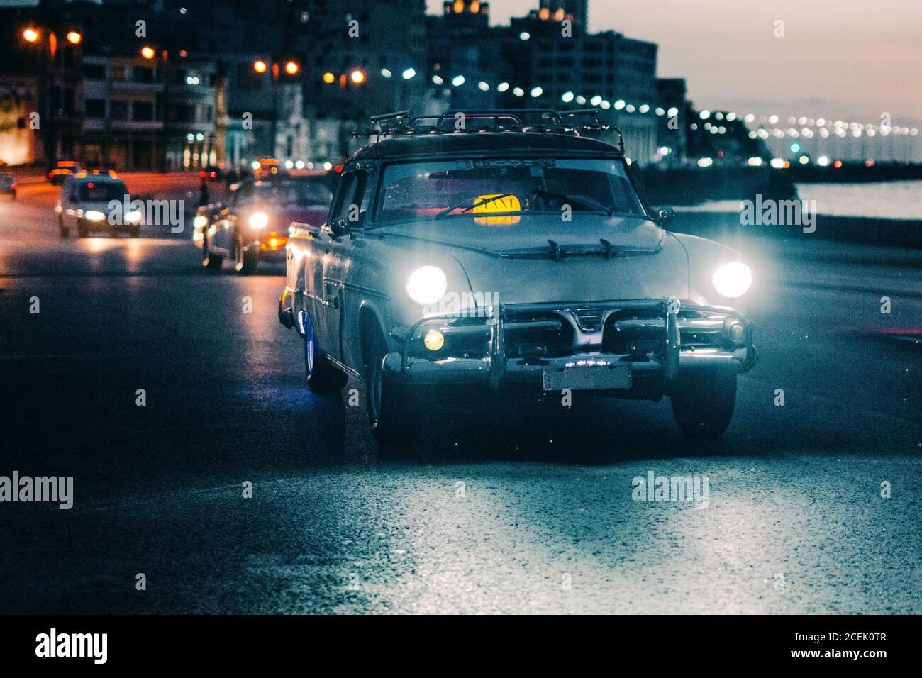 Classic car driving sunset hi-res stock photography and images - Alamy