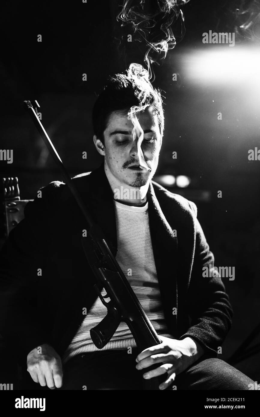 Young man gun in Black and White Stock Photos & Images - Alamy