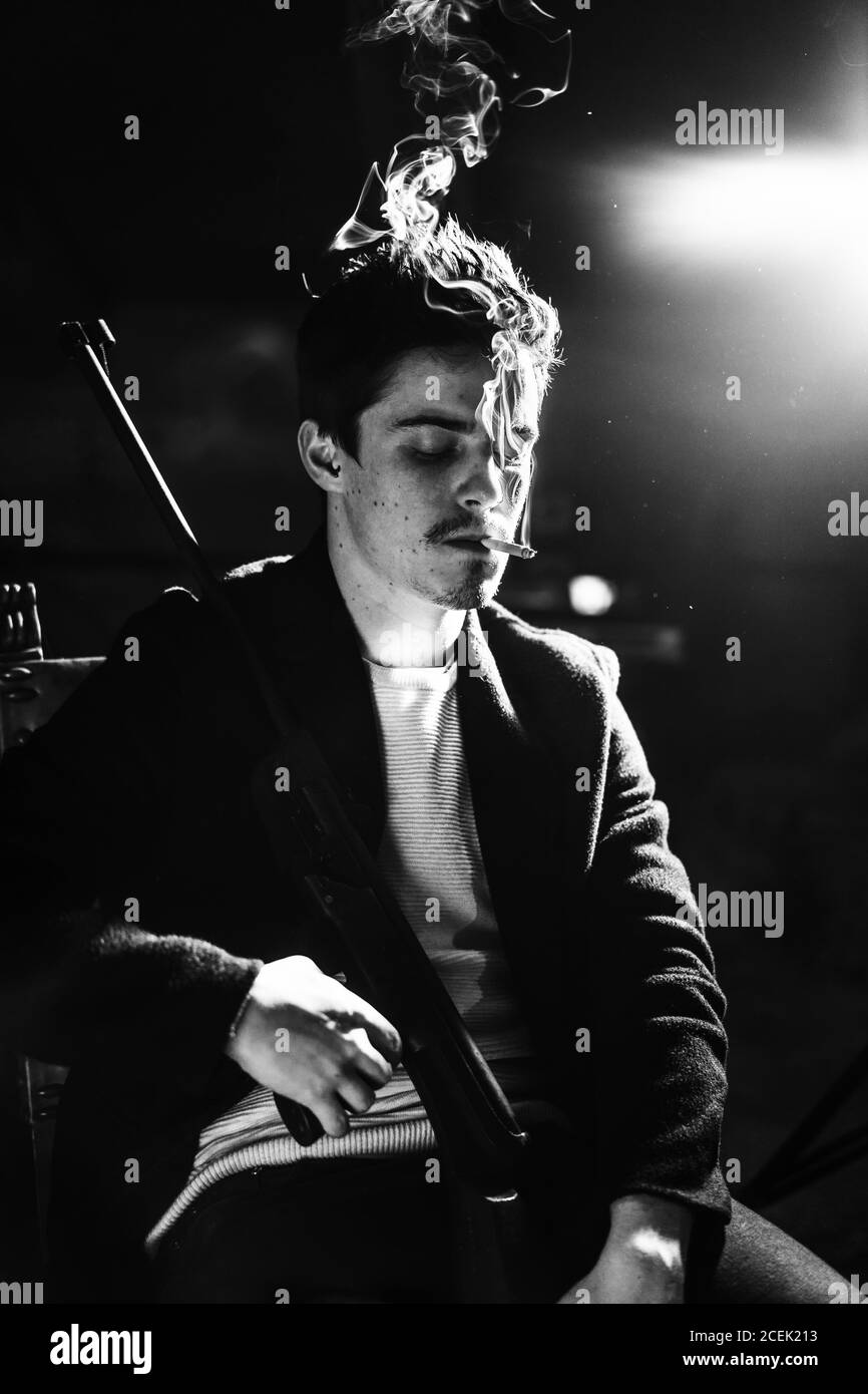 Young man gun in Black and White Stock Photos & Images - Alamy