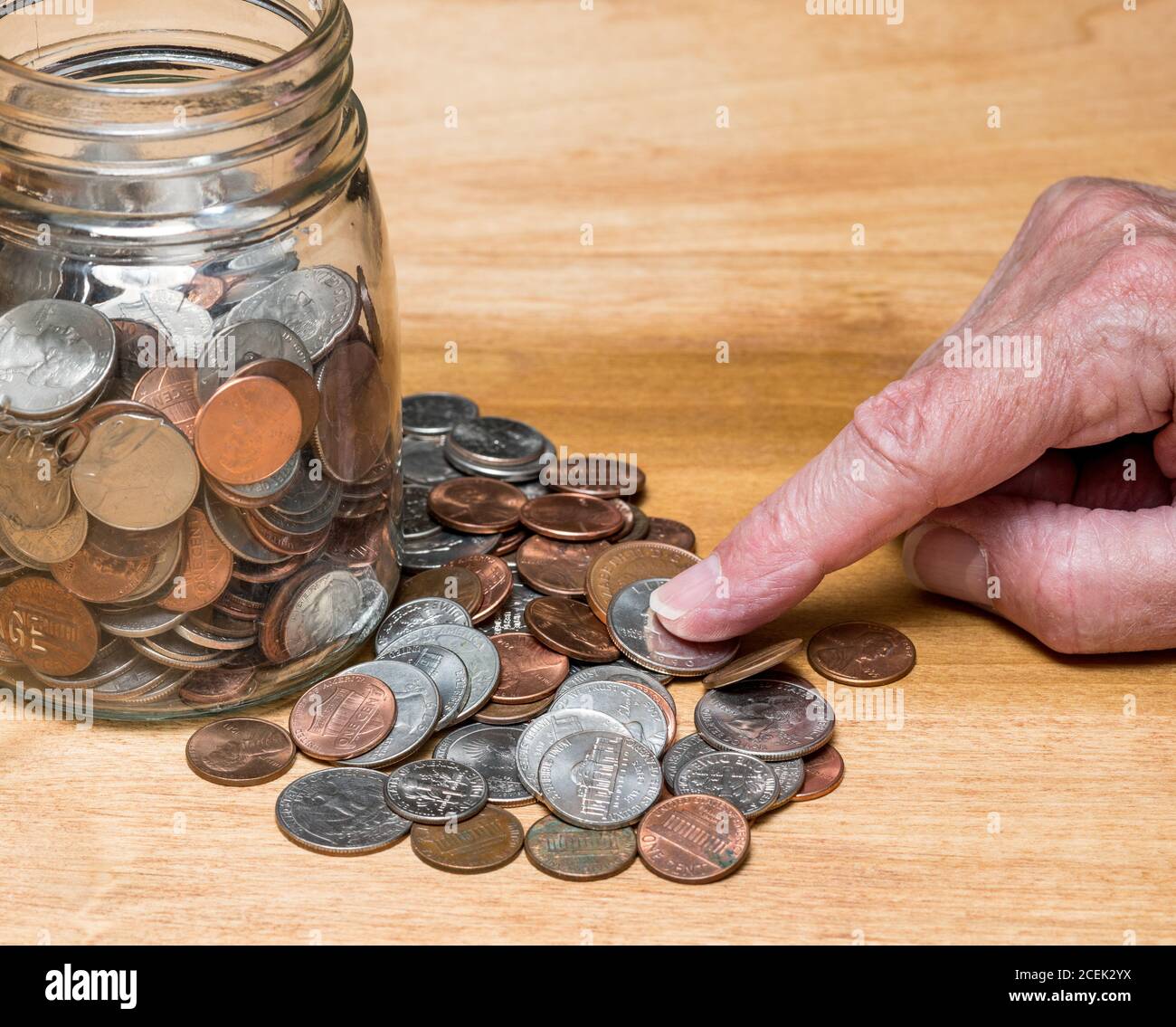 Table counting coins hi-res stock photography and images - Alamy