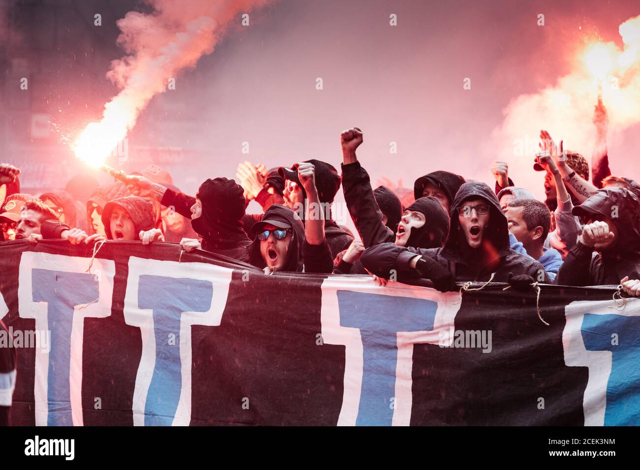 Group of aggressive people walking on street Stock Photo - Alamy
