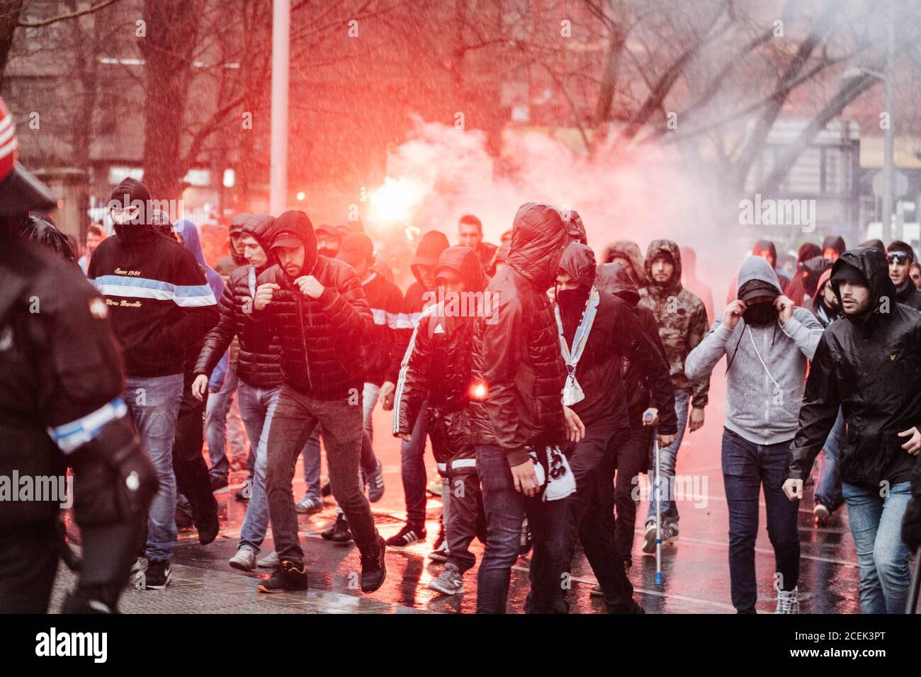 Group of aggressive people walking on street Stock Photo - Alamy