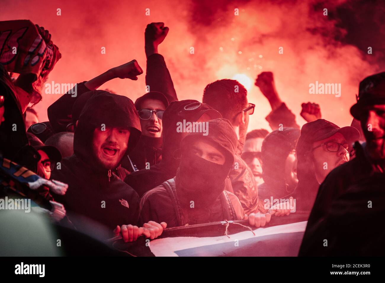 Group of aggressive people walking on street Stock Photo - Alamy