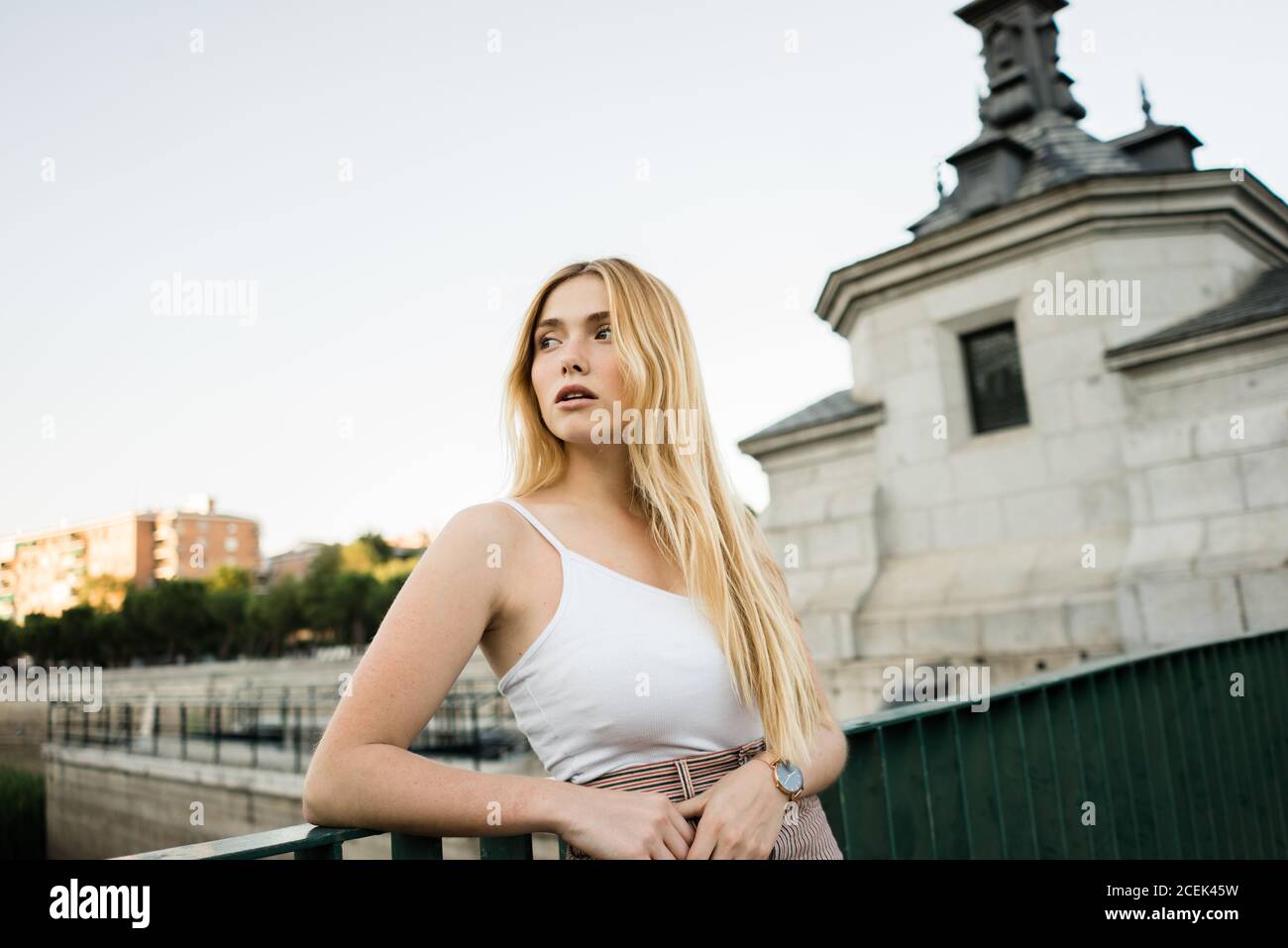 Woman leaning on railing hi-res stock photography and images - Alamy