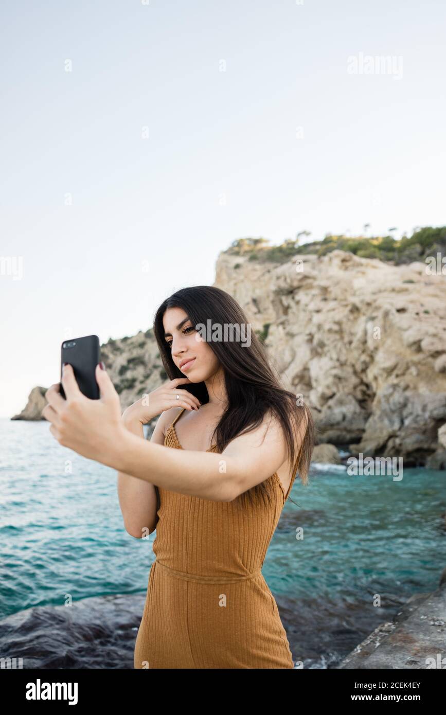 Woman taking selfie on beach hi-res stock photography and images - Alamy